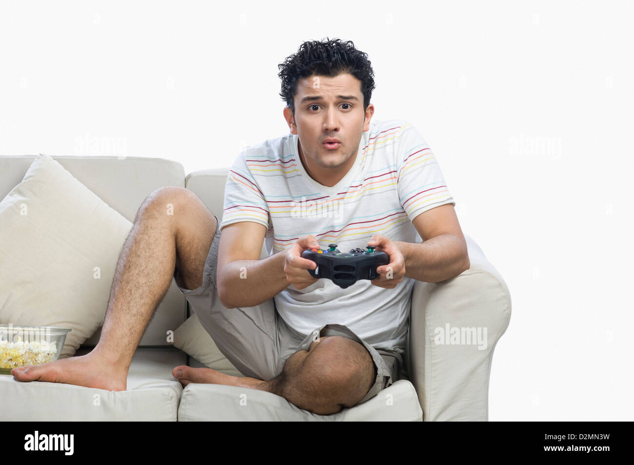 Black man holding a game controller hi-res stock photography and images ...
