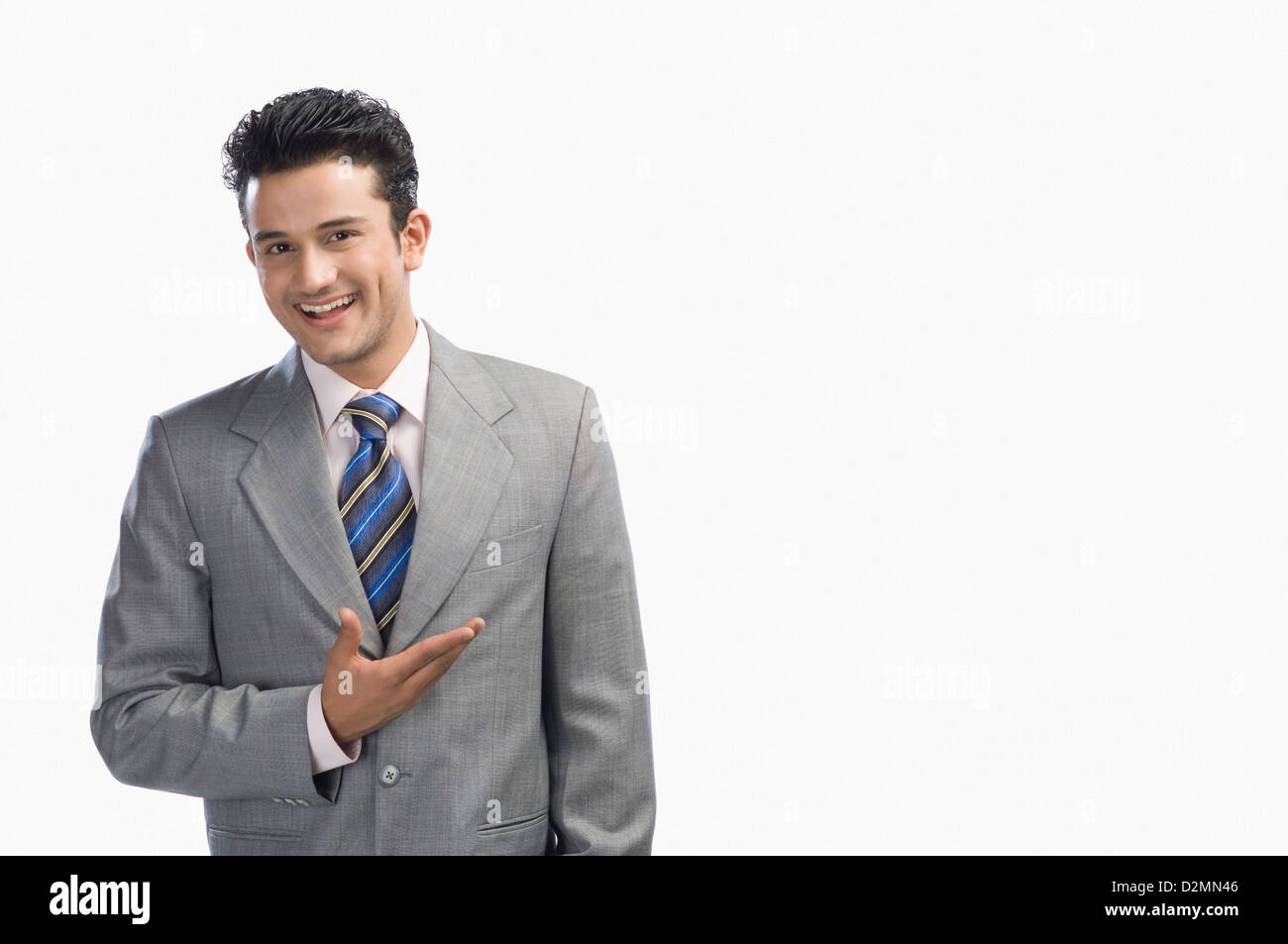 Portrait of a businessman gesturing Stock Photo - Alamy