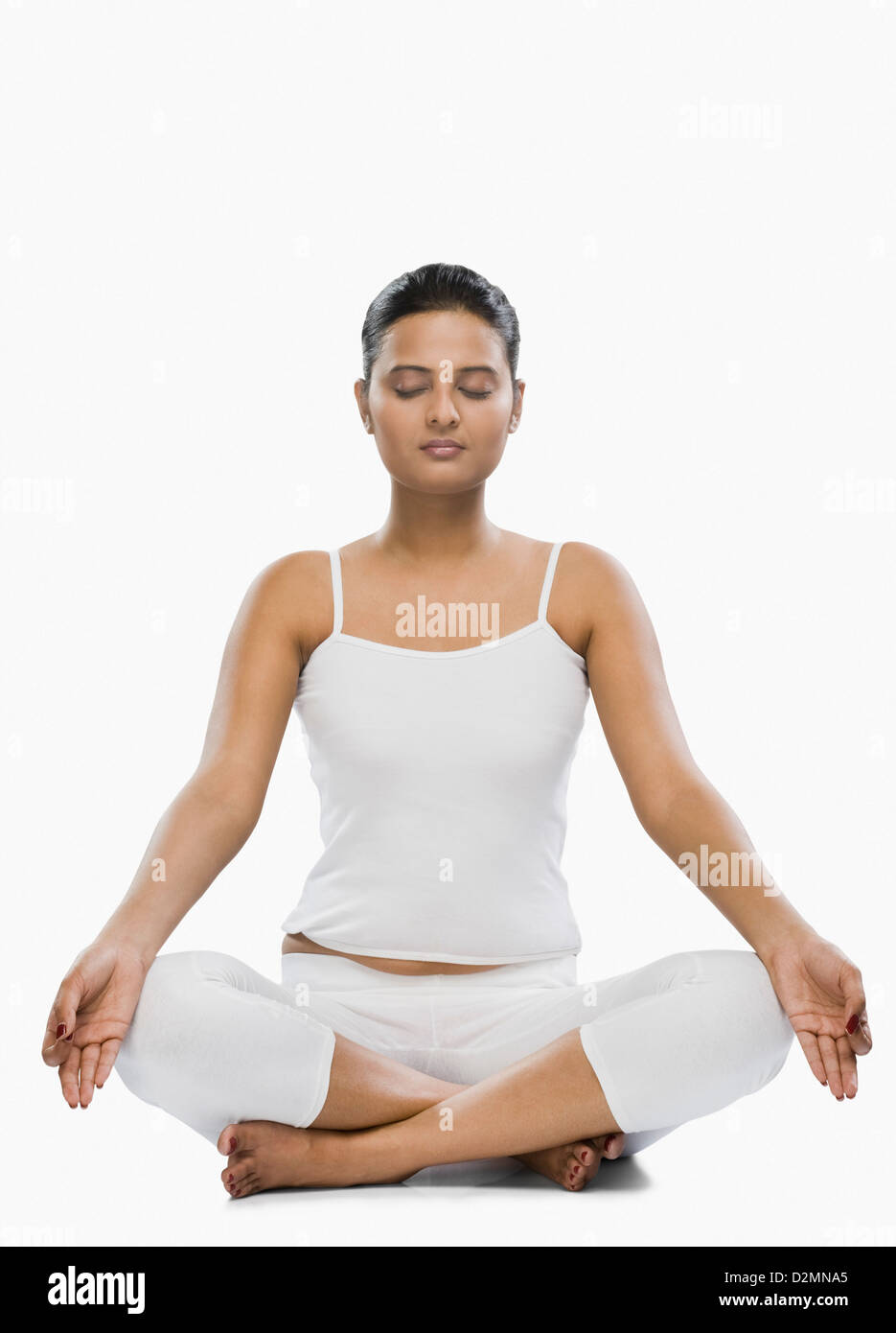 Woman doing yoga lotus pose Cut Out Stock Images & Pictures - Alamy