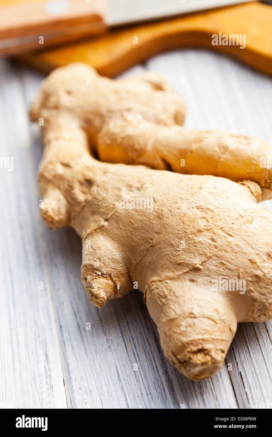 ginger root on kitchen table Stock Photo - Alamy