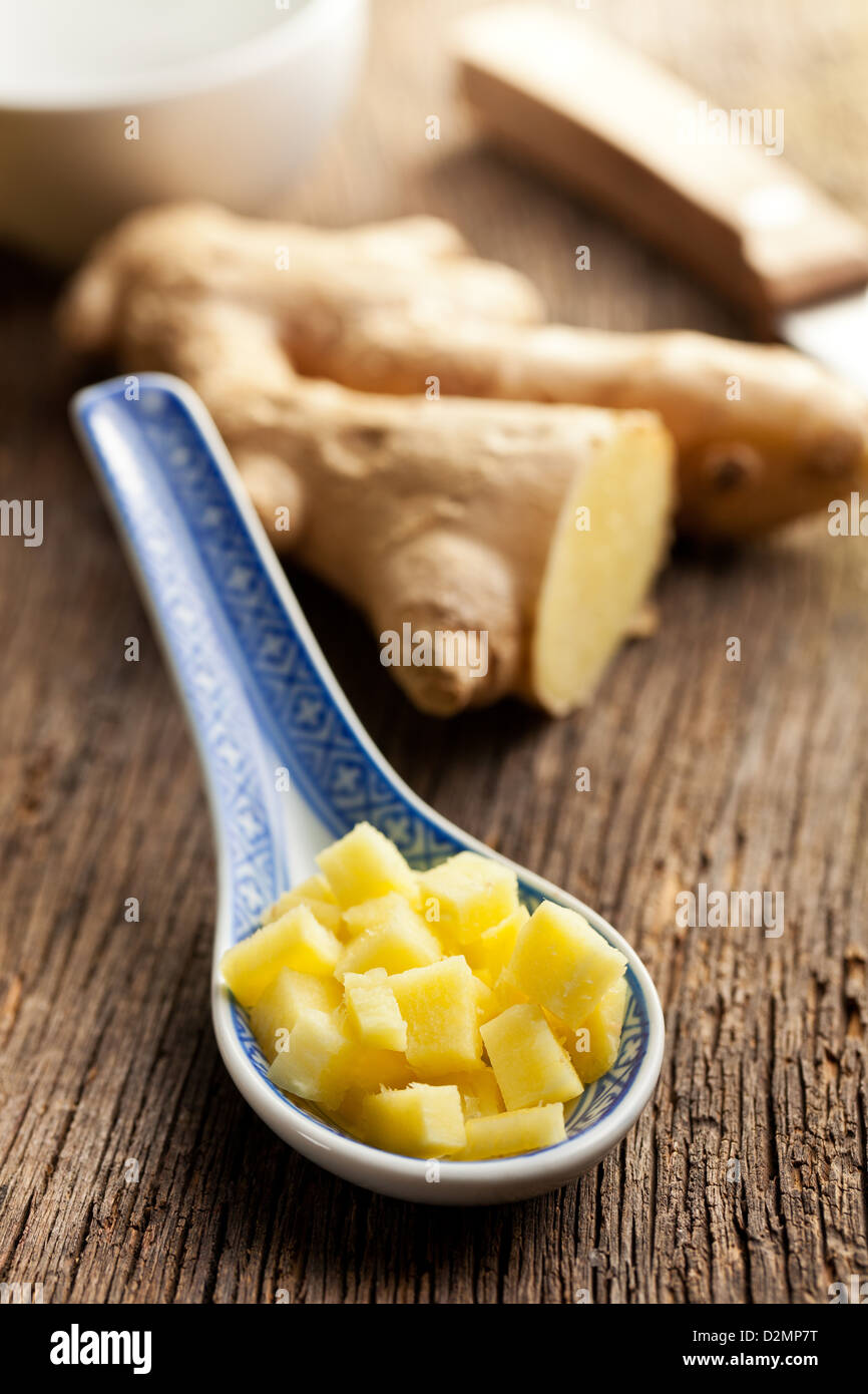 sliced ginger root on kitchen table Stock Photo - Alamy