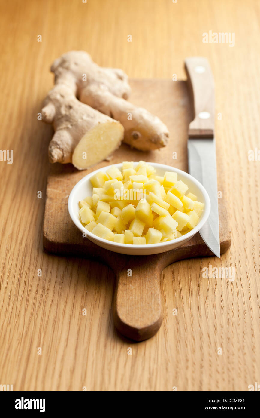 sliced ginger root on kitchen table Stock Photo - Alamy