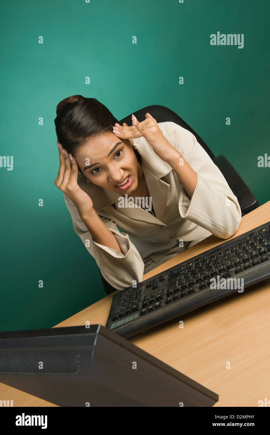 Businesswoman looking disappointed in an office Stock Photo - Alamy
