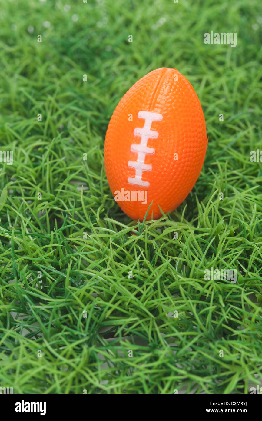 High angle view of an American football on grass Stock Photo - Alamy