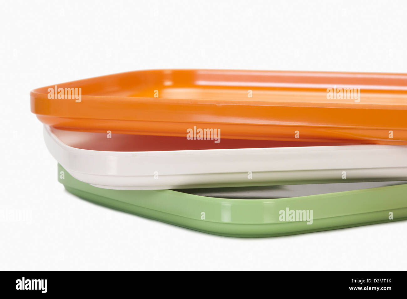 Close-up of a stack of colorful trays representing Indian flag colors ...
