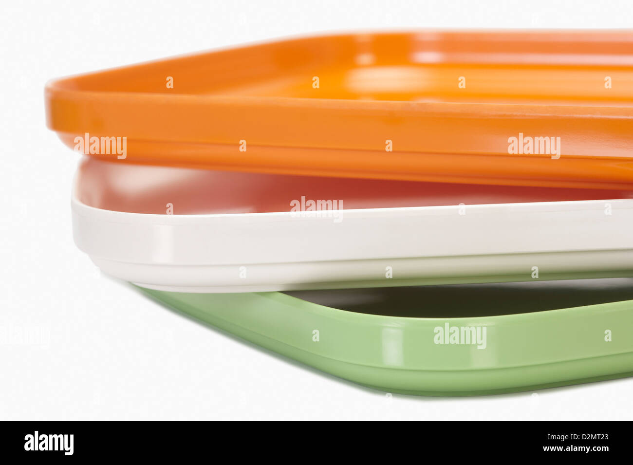 Close-up of a stack of colorful trays representing Indian flag colors ...