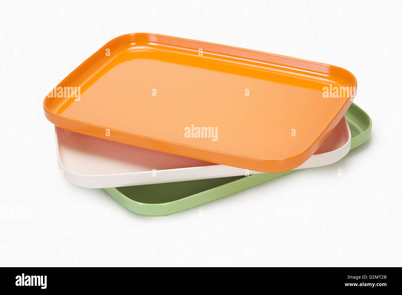 Close-up of a stack of colorful trays representing Indian flag colors ...