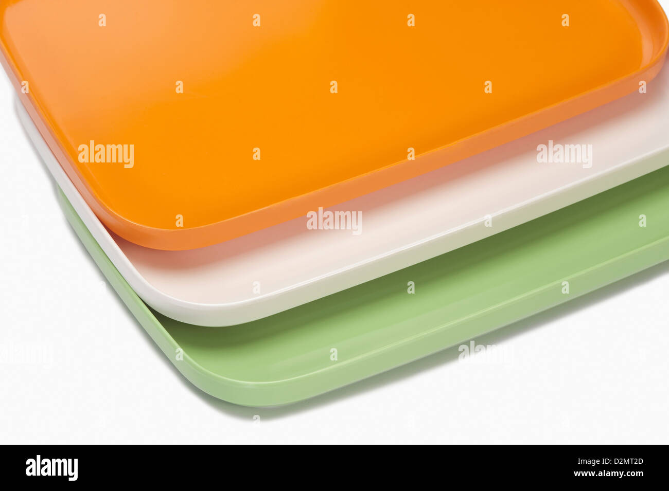 Close-up of a stack of colorful trays representing Indian flag colors ...
