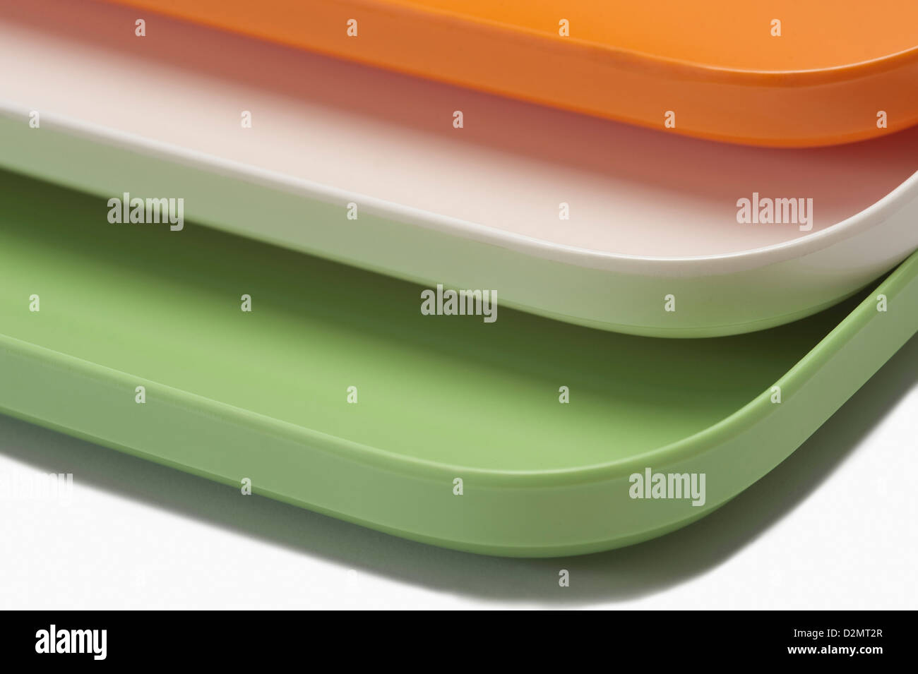 Close-up of a stack of colorful trays representing Indian flag colors ...