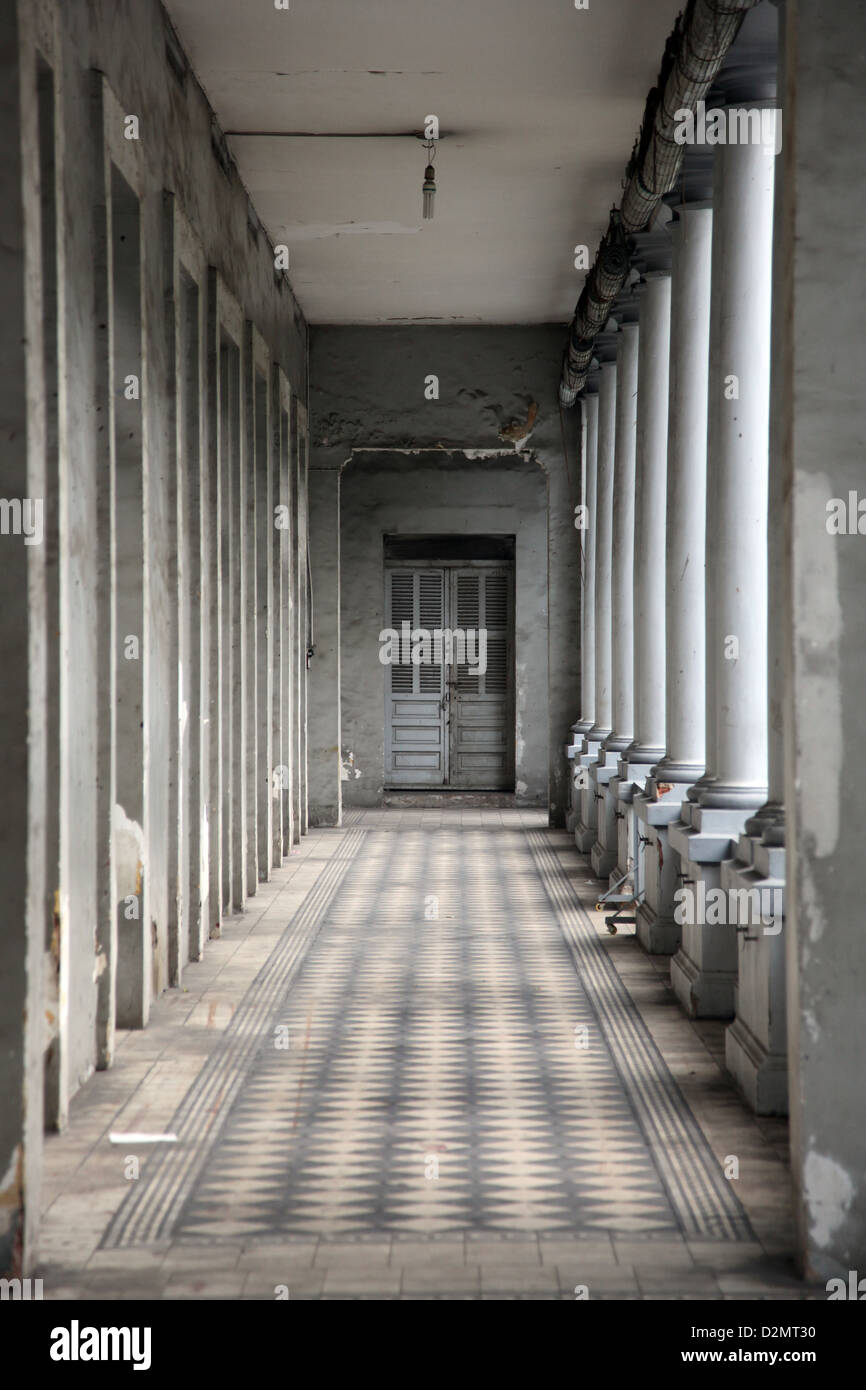 It's a photo of a corridor in an old building. It's in perspective ...