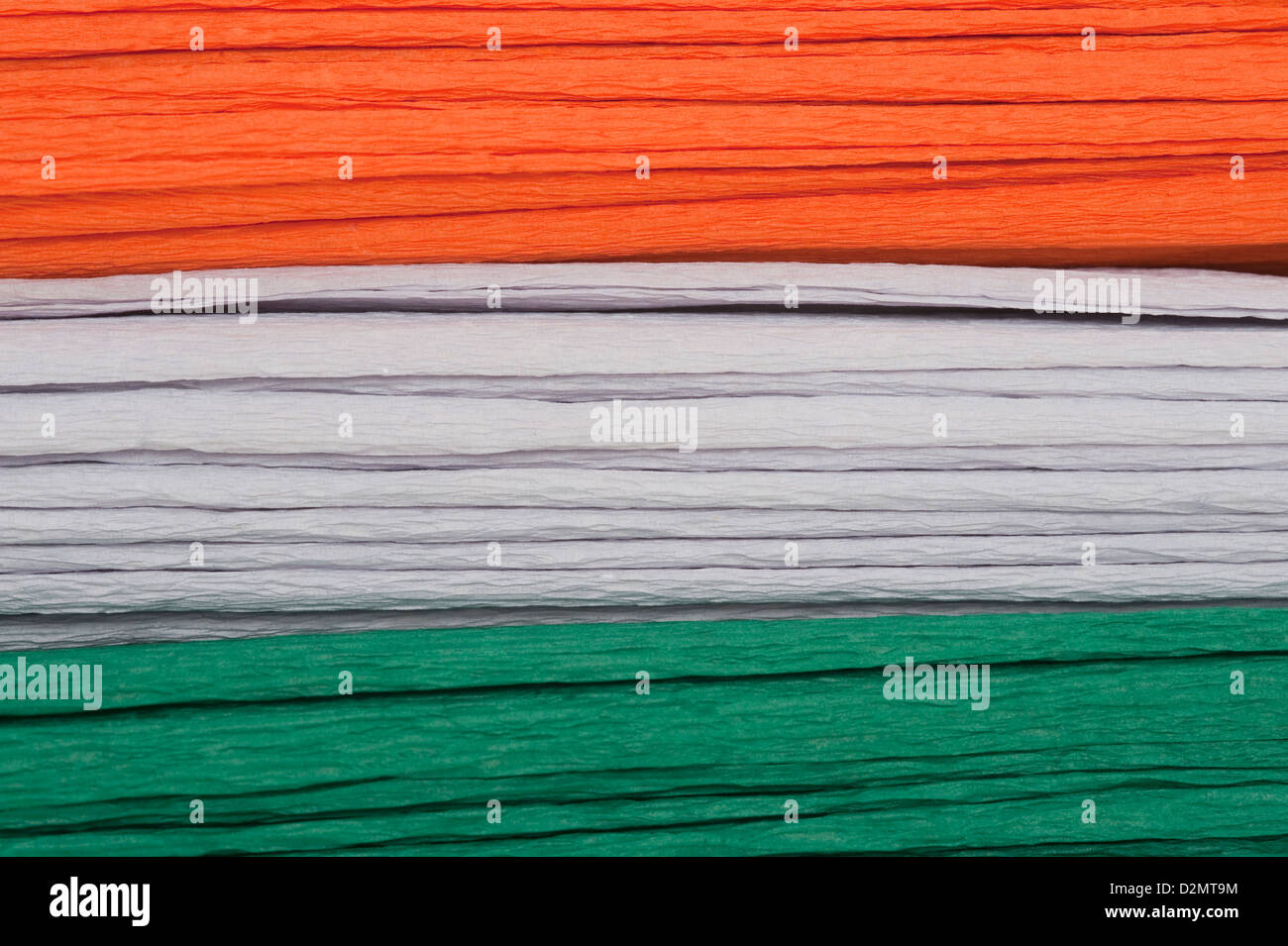 Close-up of a stack of colorful papers representing Indian flag colors ...