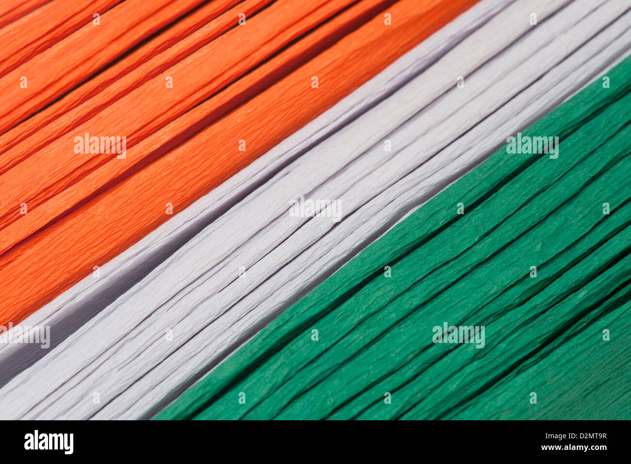 Close-up of a stack of colorful papers representing Indian flag colors ...