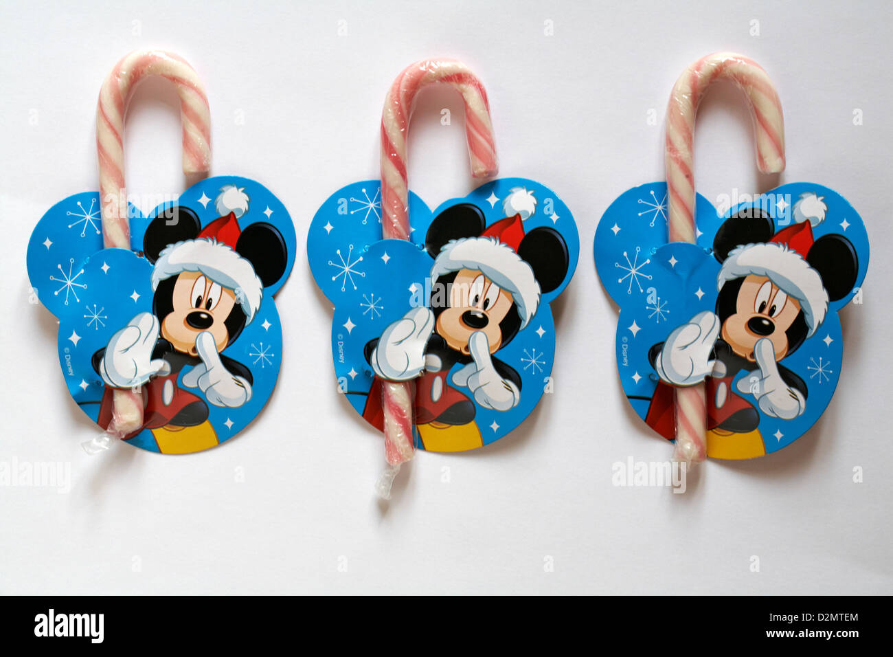 three Minnie Mouse Disney fruit flavoured Candy Canes isolated on white ...