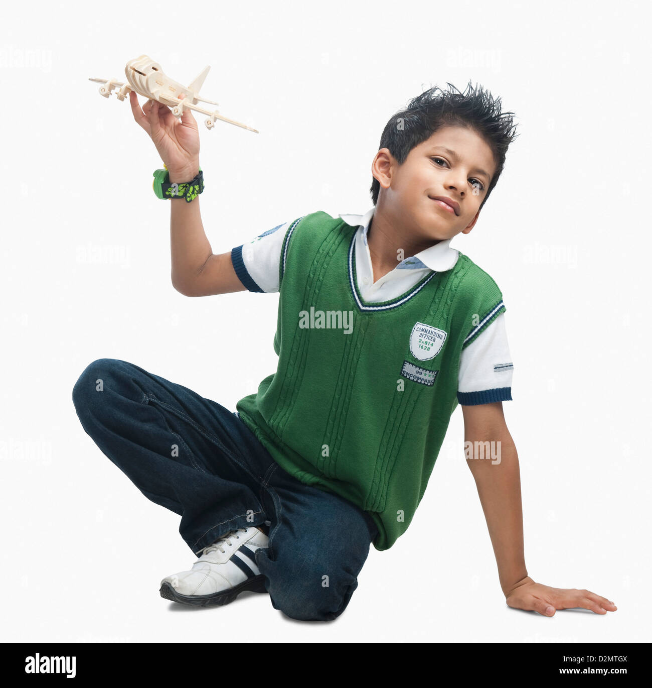 Portrait of a boy playing with a toy airplane Stock Photo - Alamy