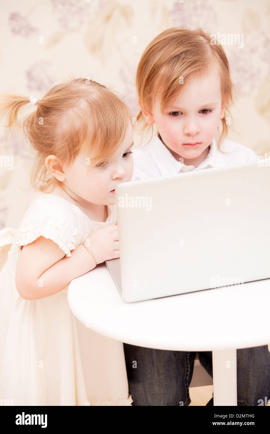 Children with laptop indoors Stock Photo - Alamy