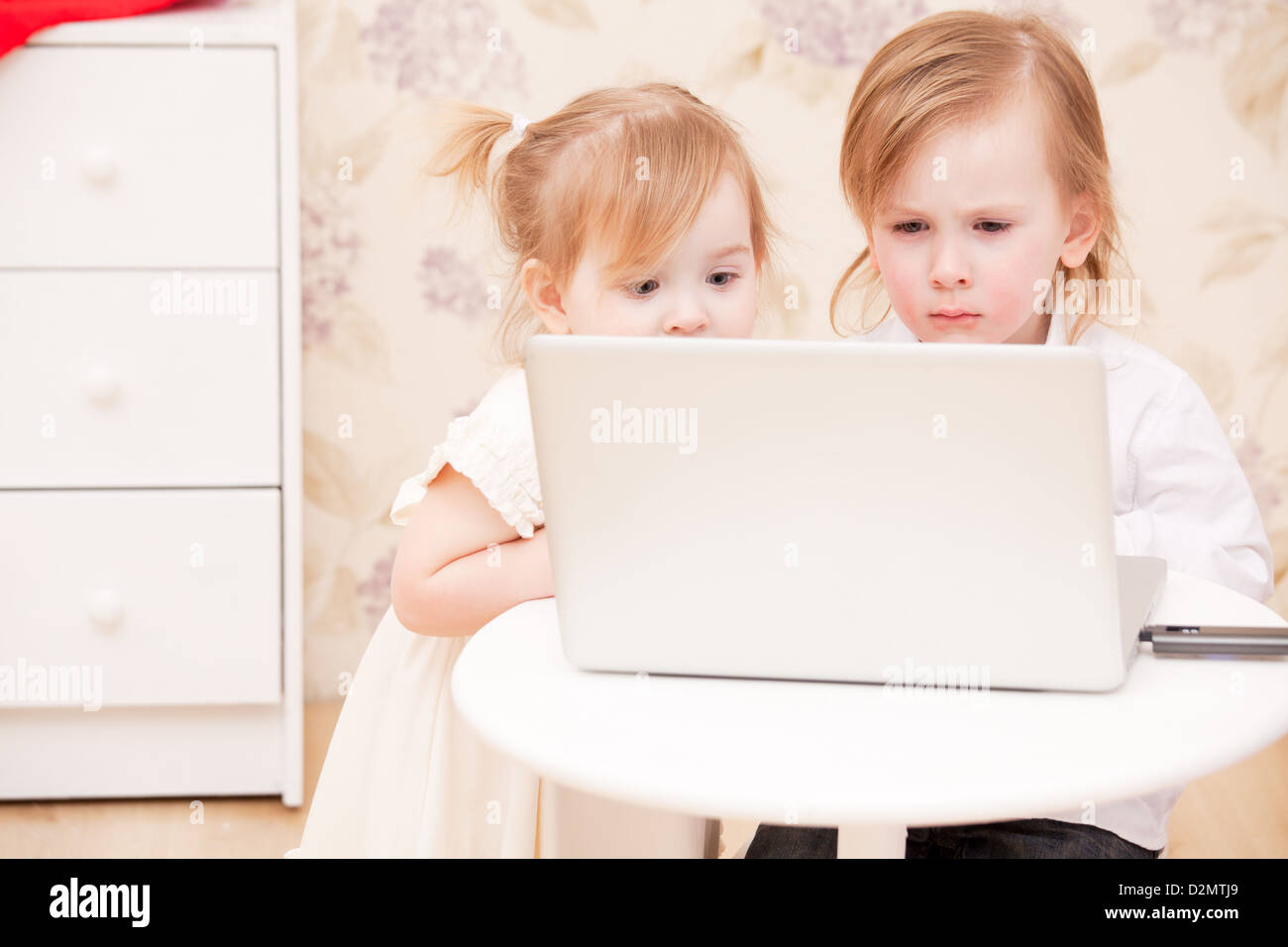 Children with laptop indoors Stock Photo - Alamy