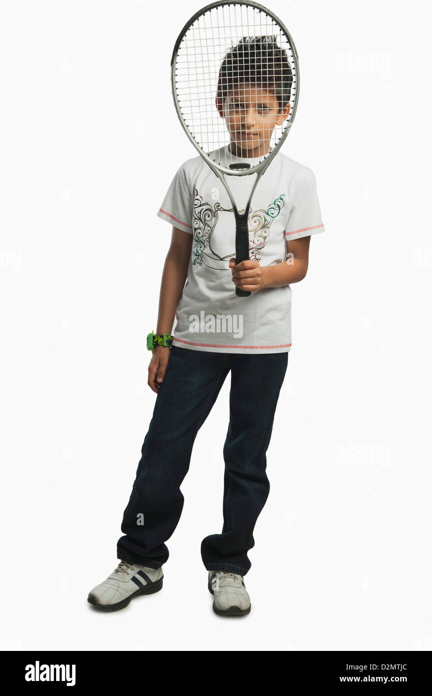 Portrait of a boy holding a tennis racket Stock Photo - Alamy