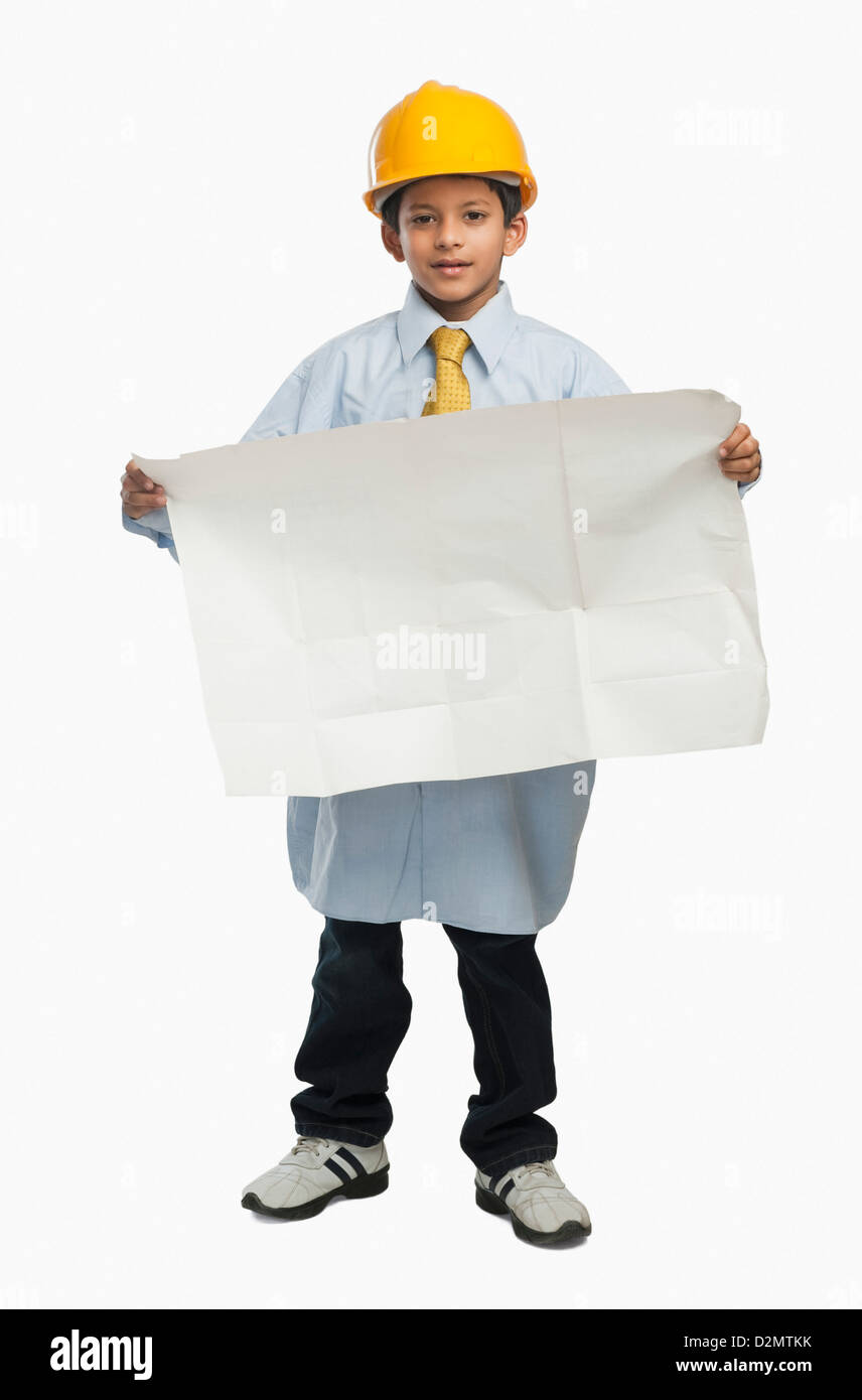 Boy dressed as an architect and showing a blueprint Stock Photo - Alamy