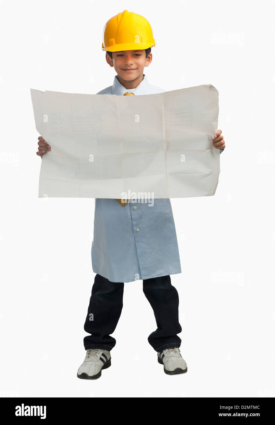 Boy dressed as an architect and showing a blueprint Stock Photo - Alamy
