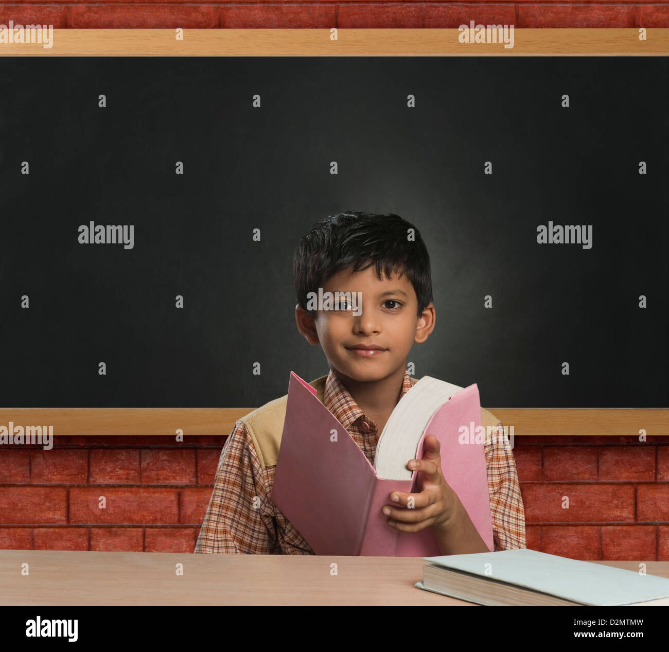 Boy imitating a teacher in a classroom Stock Photo - Alamy