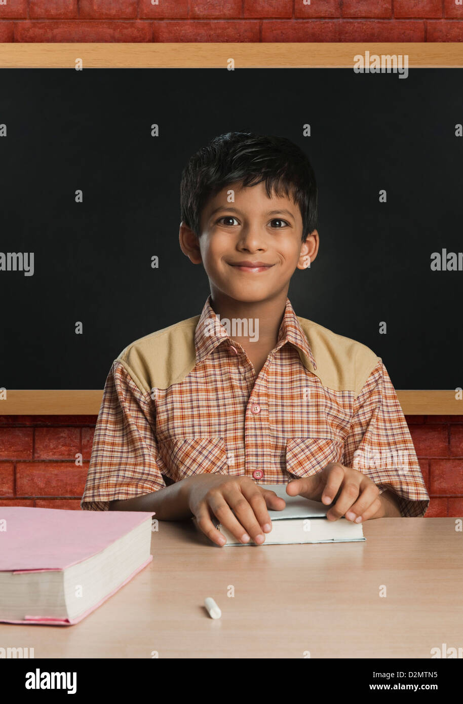 Boy imitating a teacher in a classroom Stock Photo - Alamy