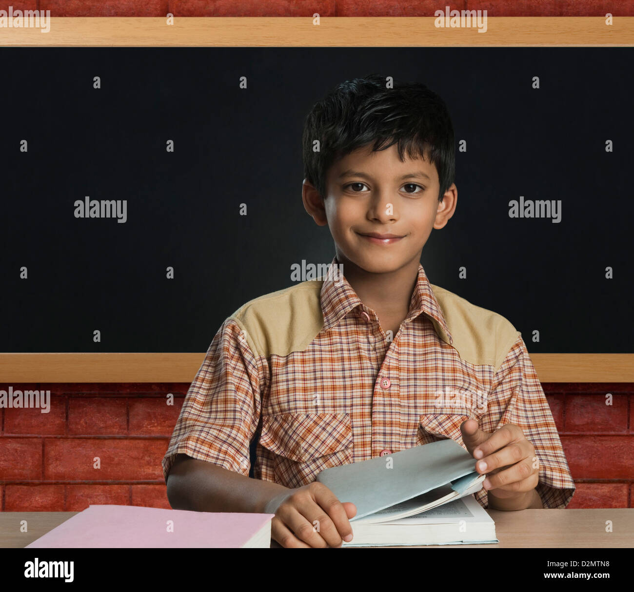 Boy imitating a teacher in a classroom Stock Photo - Alamy