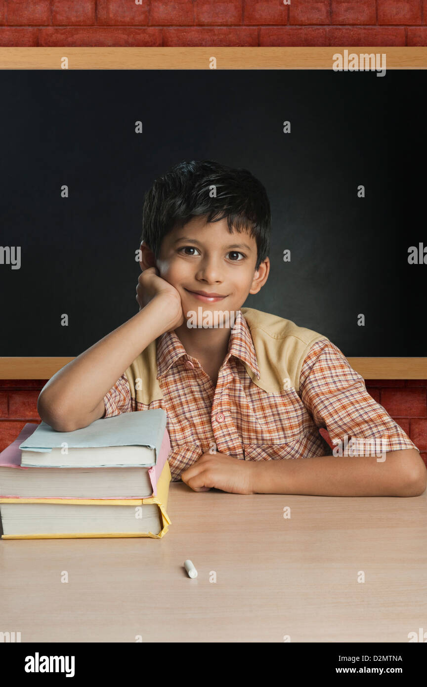 Boy imitating a teacher in a classroom Stock Photo - Alamy