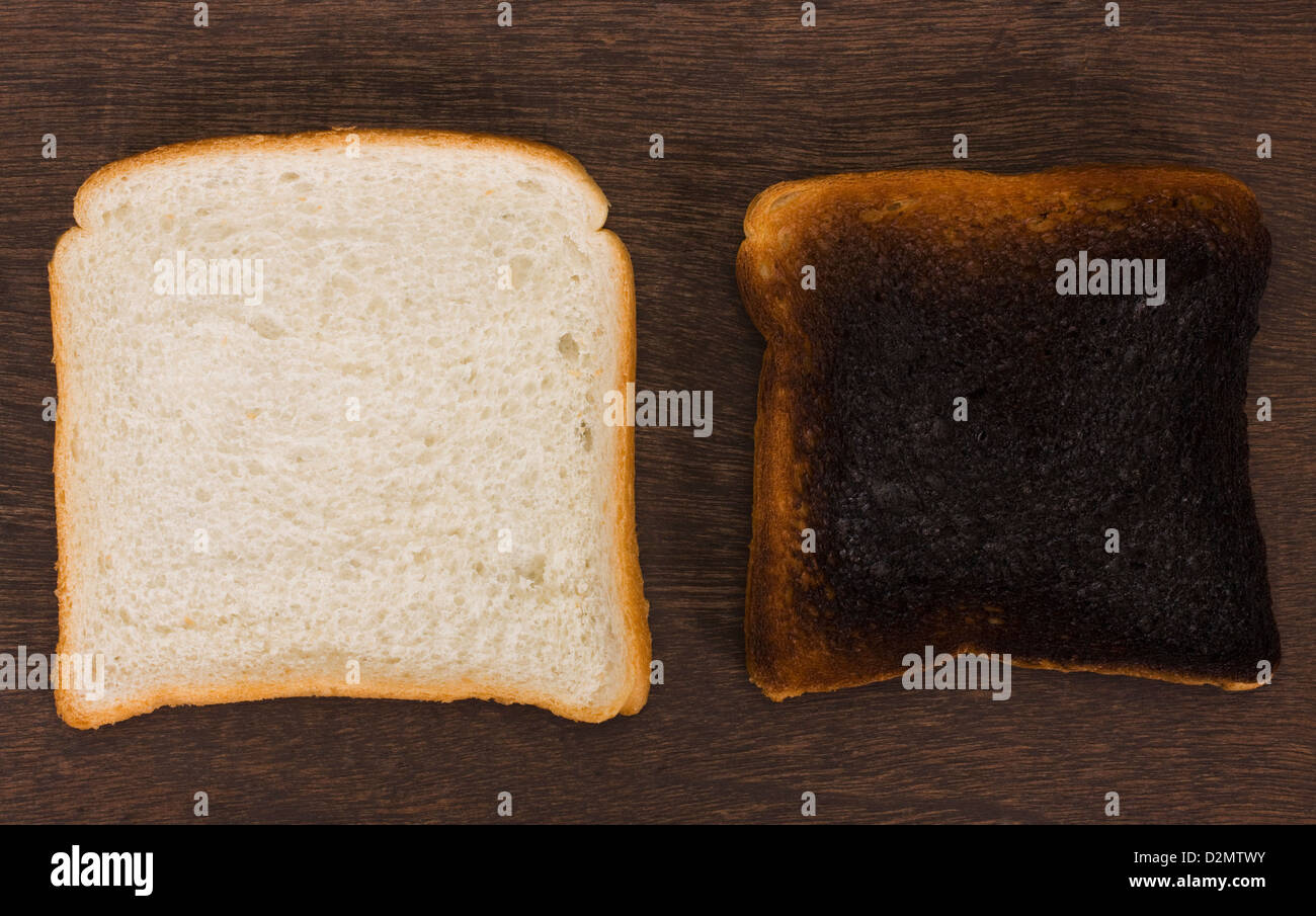 Slice of a bread with a burnt toast Stock Photo - Alamy