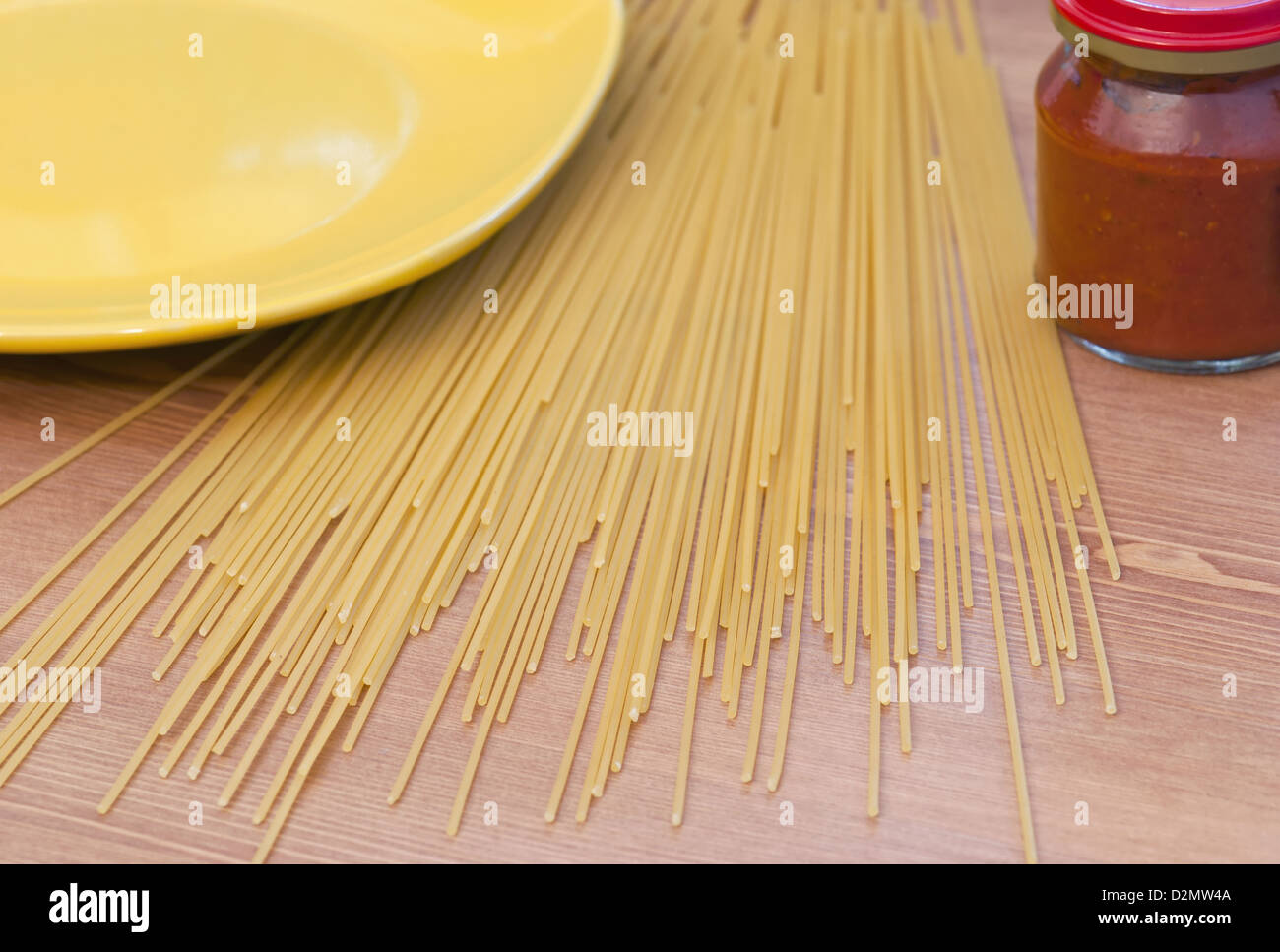 Italian spaghetti with tomato sauce and yellow bowl on the table Stock ...