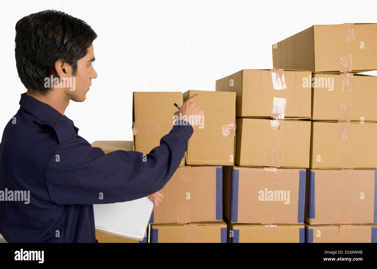 Store incharge counting cardboard boxes Stock Photo - Alamy