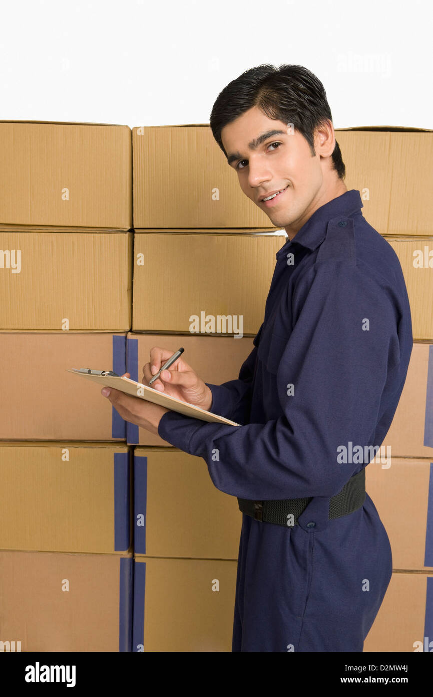 Store incharge checking inventory Stock Photo - Alamy
