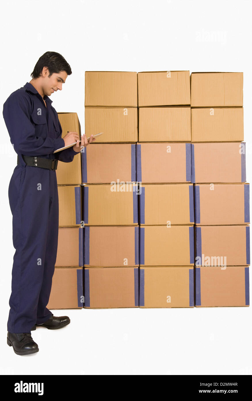 Store incharge checking inventory Stock Photo - Alamy