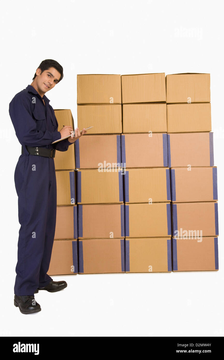 Store incharge checking inventory Stock Photo - Alamy