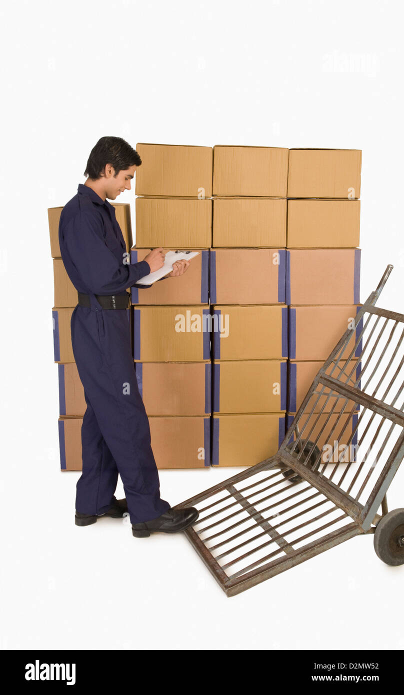 Store incharge checking inventory Stock Photo - Alamy