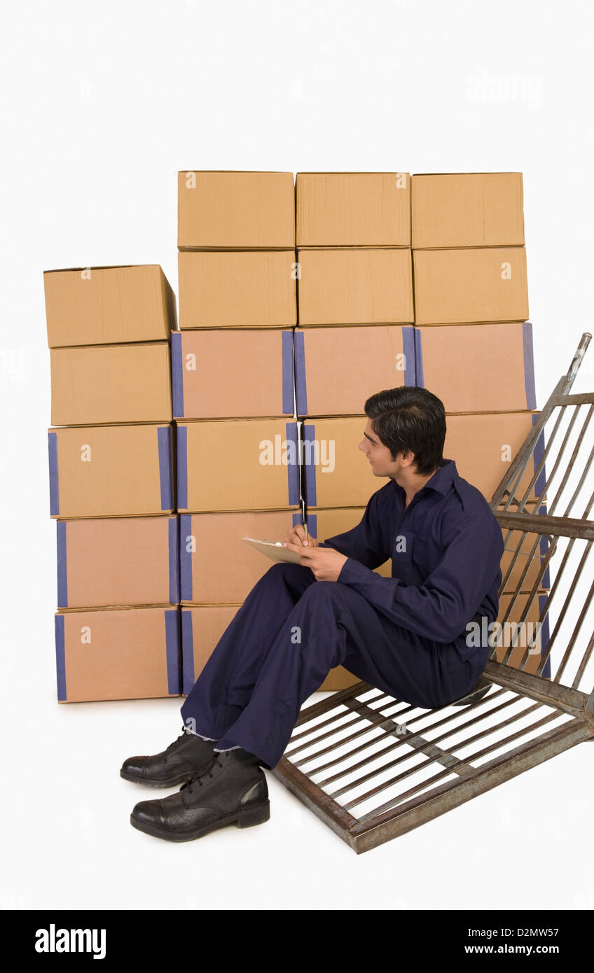 Store incharge checking inventory Stock Photo - Alamy