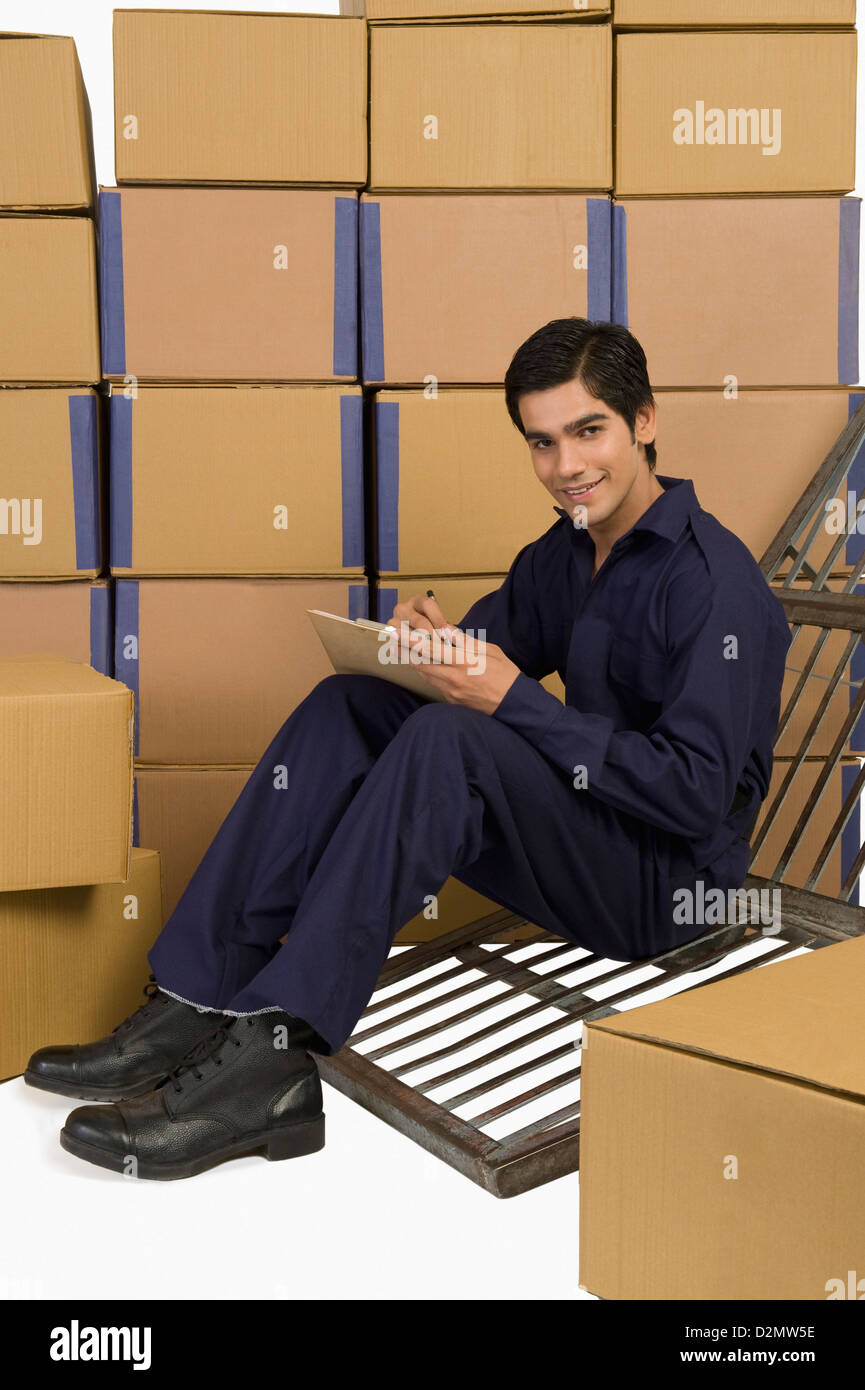 Store incharge checking inventory Stock Photo - Alamy