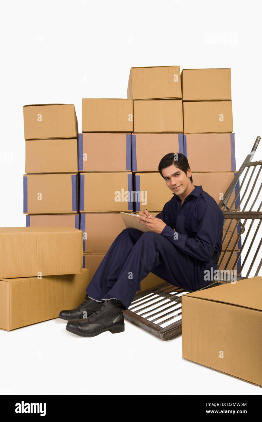 Store incharge checking inventory Stock Photo - Alamy