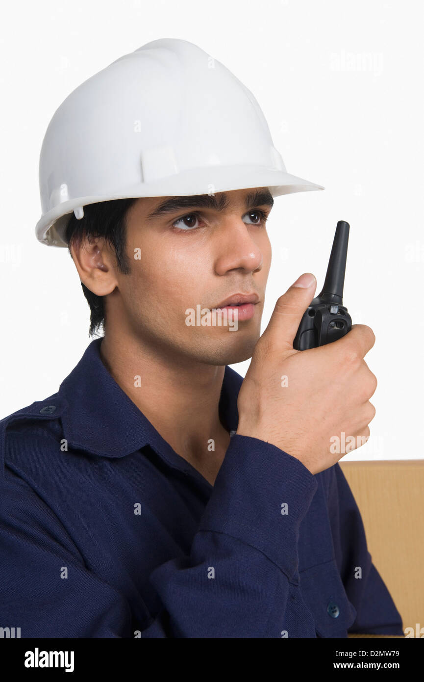 Store incharge on a walkie-talkie Stock Photo - Alamy