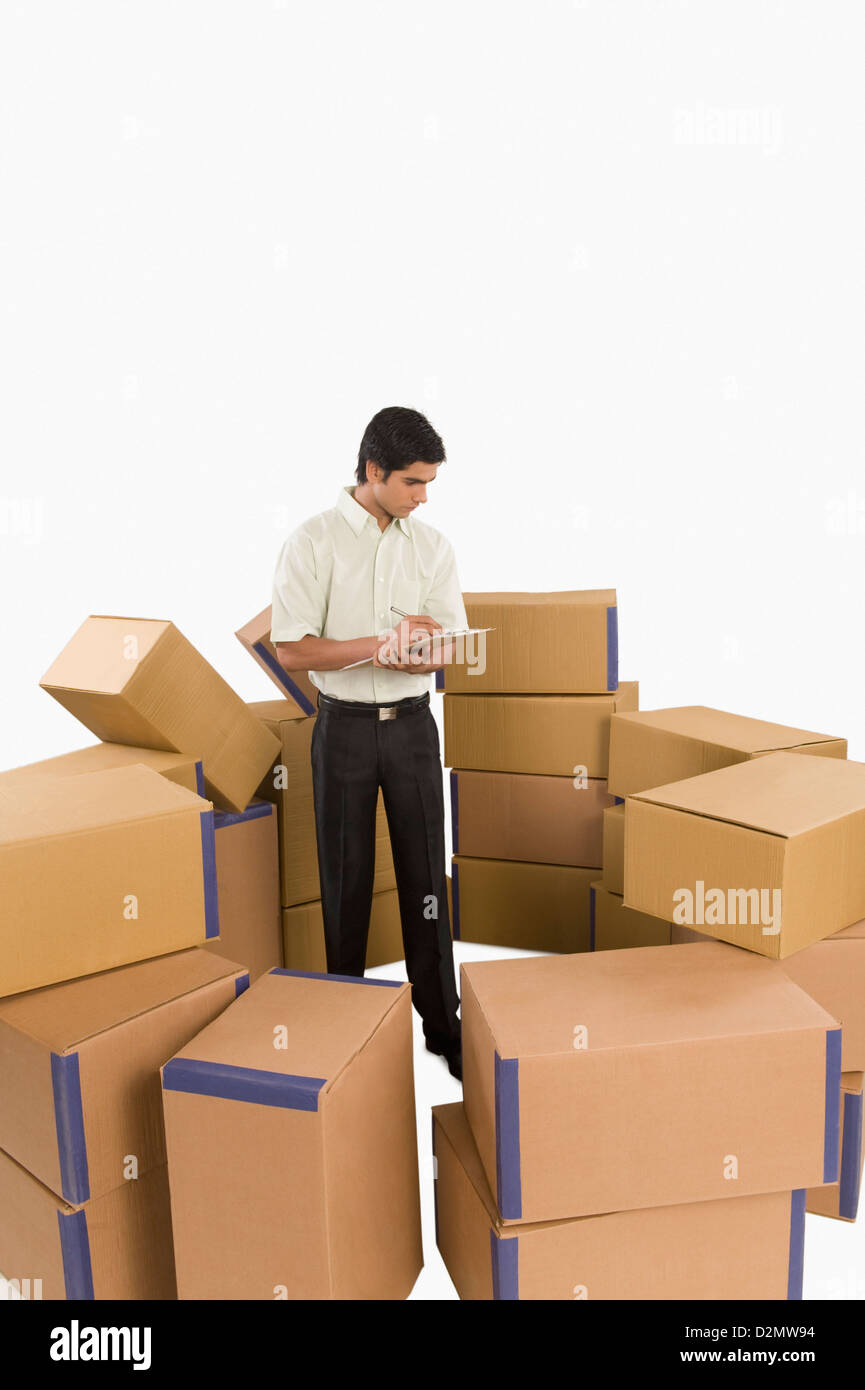 Store incharge checking inventory Stock Photo - Alamy