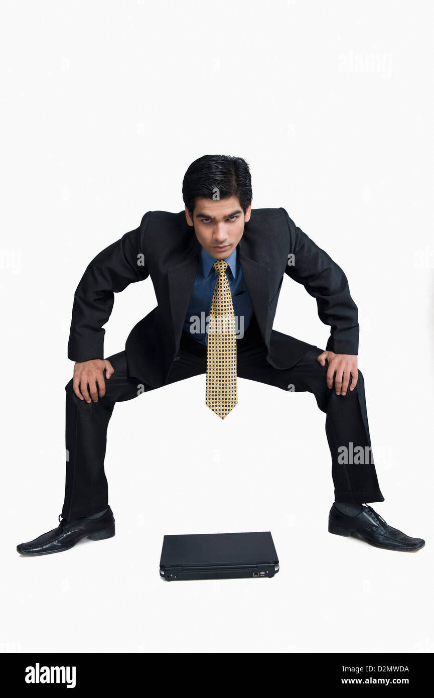 Man in suit crouching on hi-res stock photography and images - Alamy