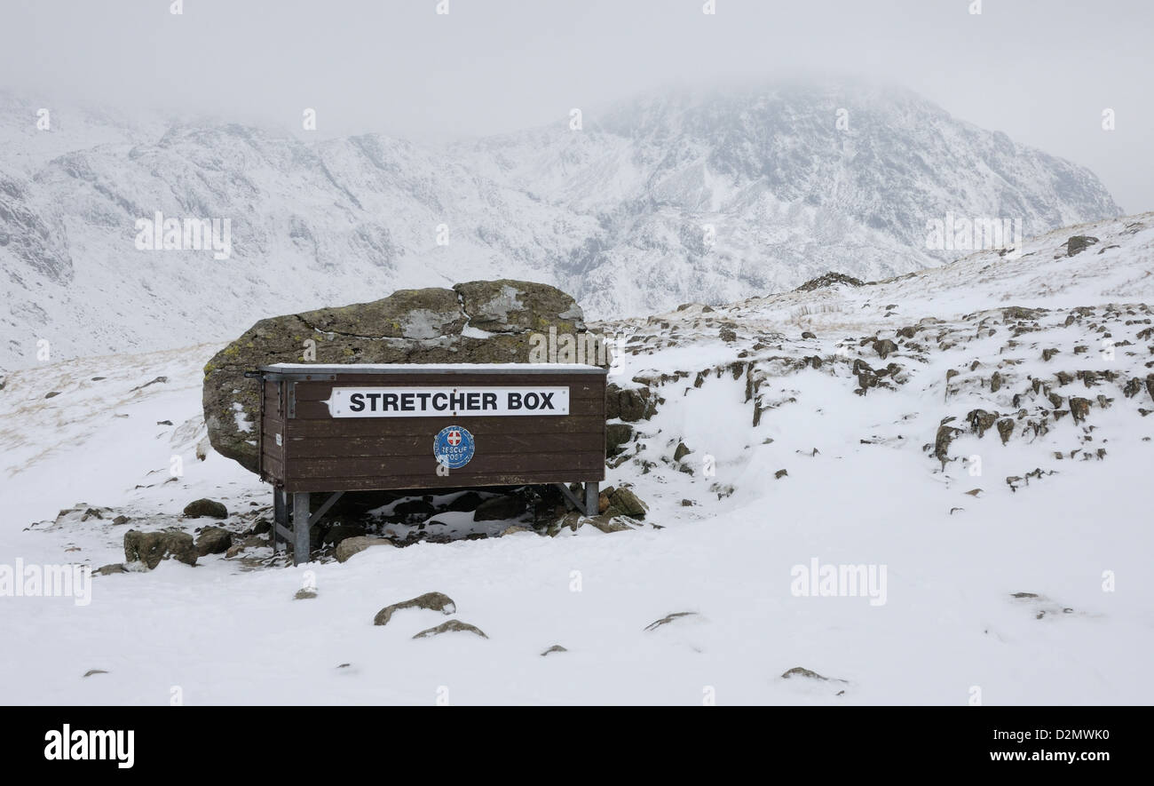 Mountain rescue stretcher box at Styhead in winter in the English Lake ...