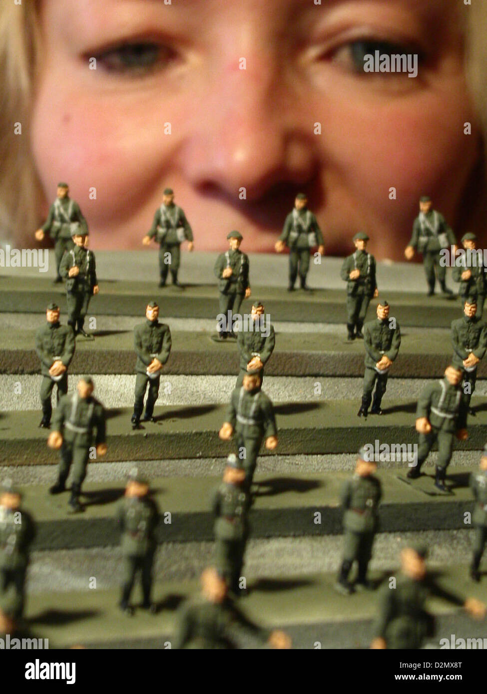 Tin figure painter Angelika Hauser looks at miniature NVA soldiers ...