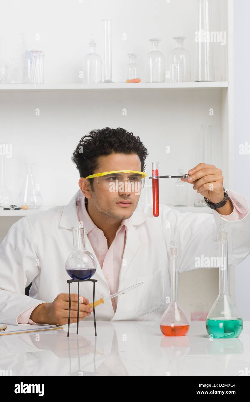 Scientist experimenting in a laboratory Stock Photo - Alamy