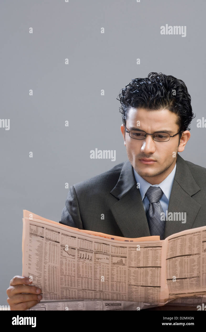 Indian businessman reading financial hi-res stock photography and ...