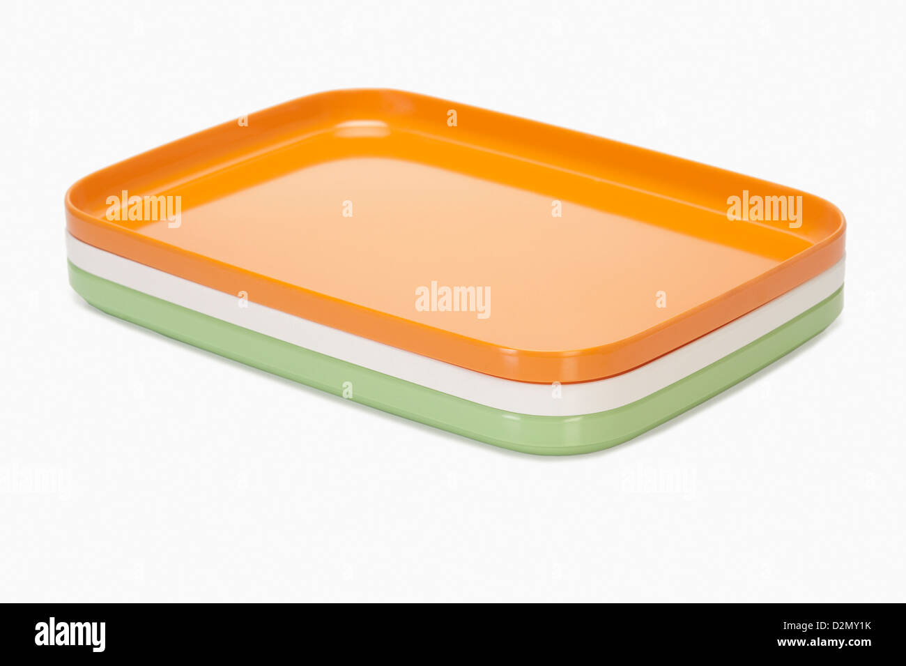 Close-up of a stack of colorful trays representing Indian flag colors ...