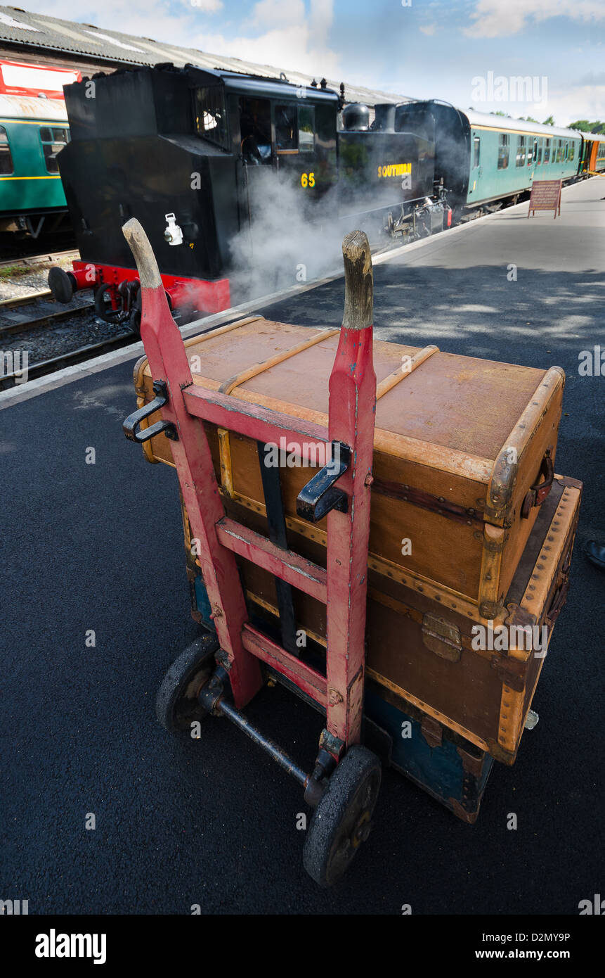 Luggage on a trolley at a steam railway station Stock Photo - Alamy