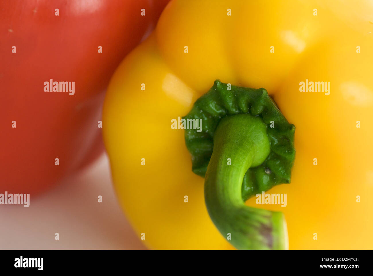 Yellow Pepper with green stalk and red pepper, close shot Stock Photo ...