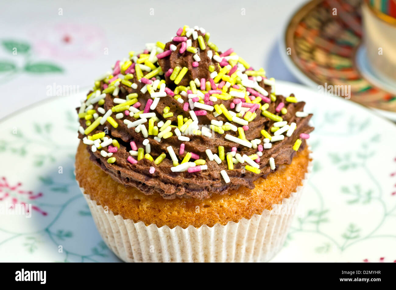 Muffins with colored cream Stock Photo - Alamy