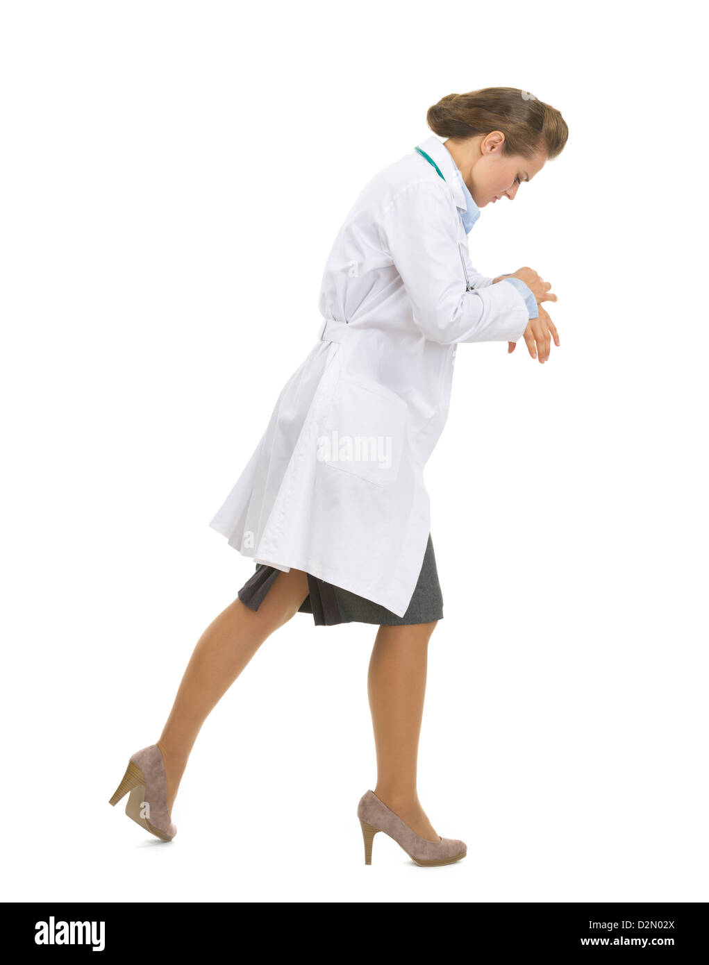 Busy medical doctor woman going sideways Stock Photo - Alamy