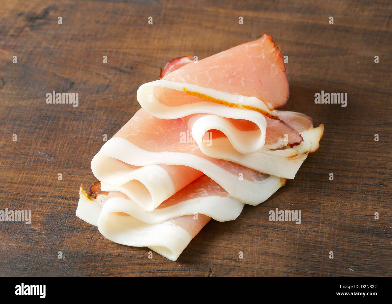 Delicious dry-cured ham sliced paper thin Stock Photo - Alamy